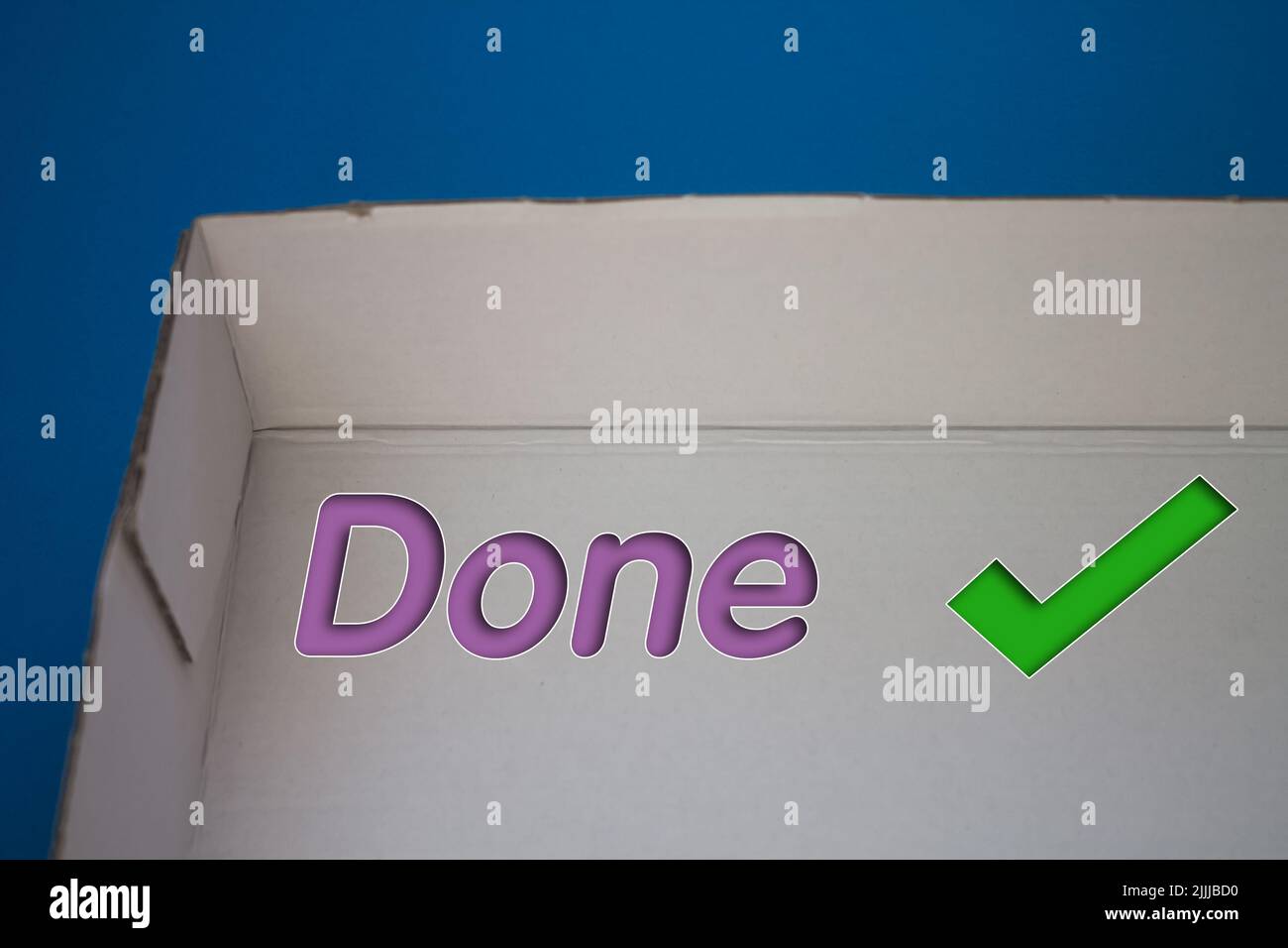 Done text with Checkmark with cardboard box. Brown folded cardbox Stock ...