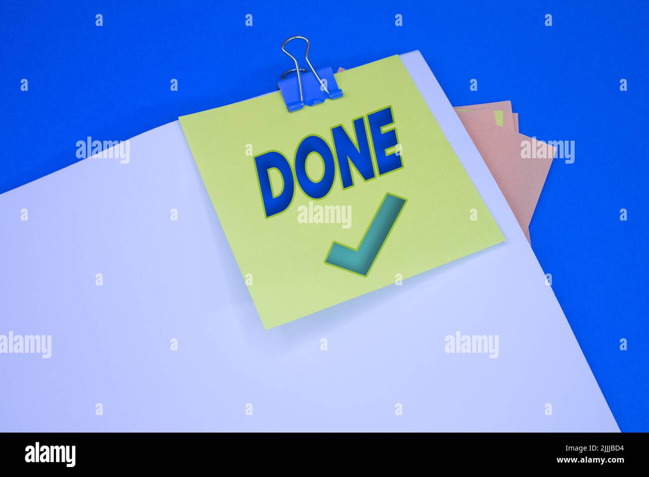 Done text with Checkmark. Text on adhesive note paper. Event ...