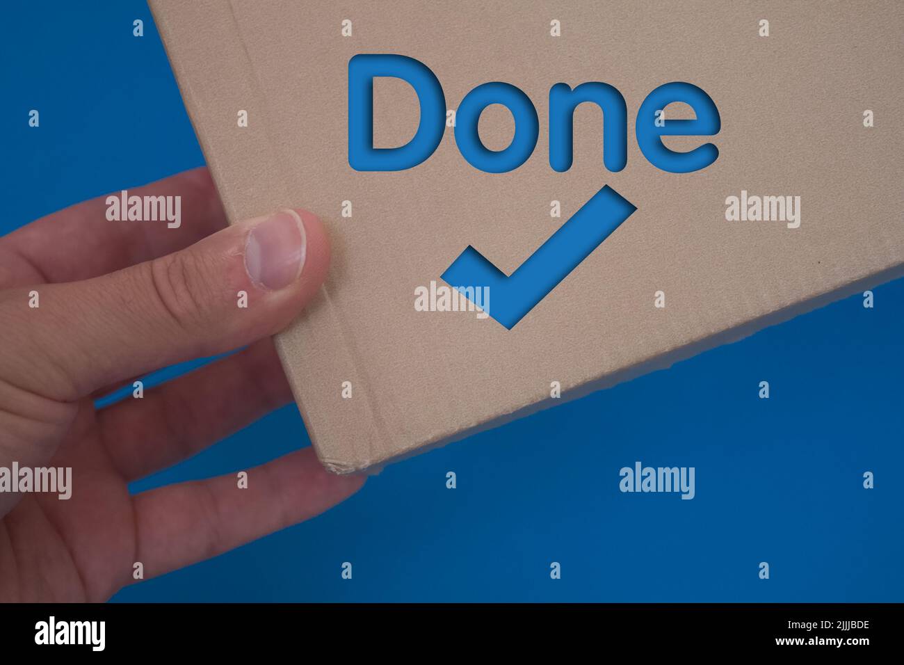 Done text with Checkmark with cardboard box. Brown folded cardbox Stock ...