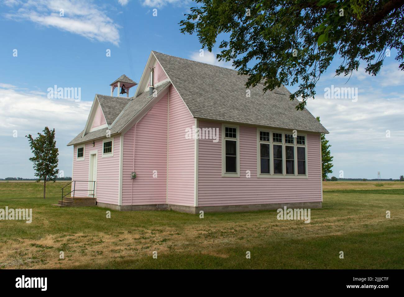 Landscape view of an old historic pink country school house exterior ...