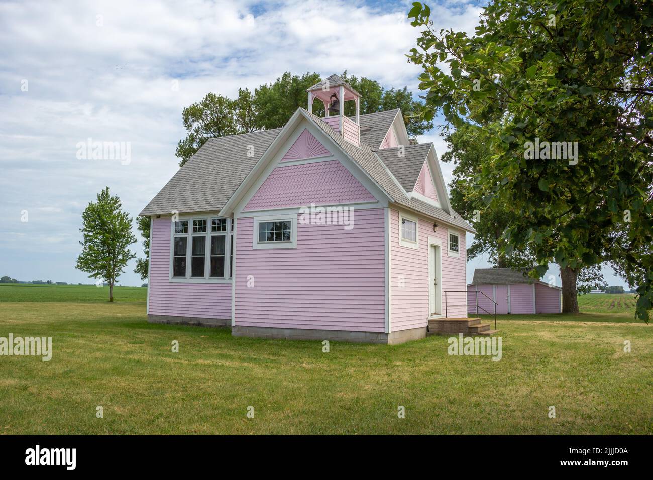 Landscape view of an old historic pink country school house exterior ...