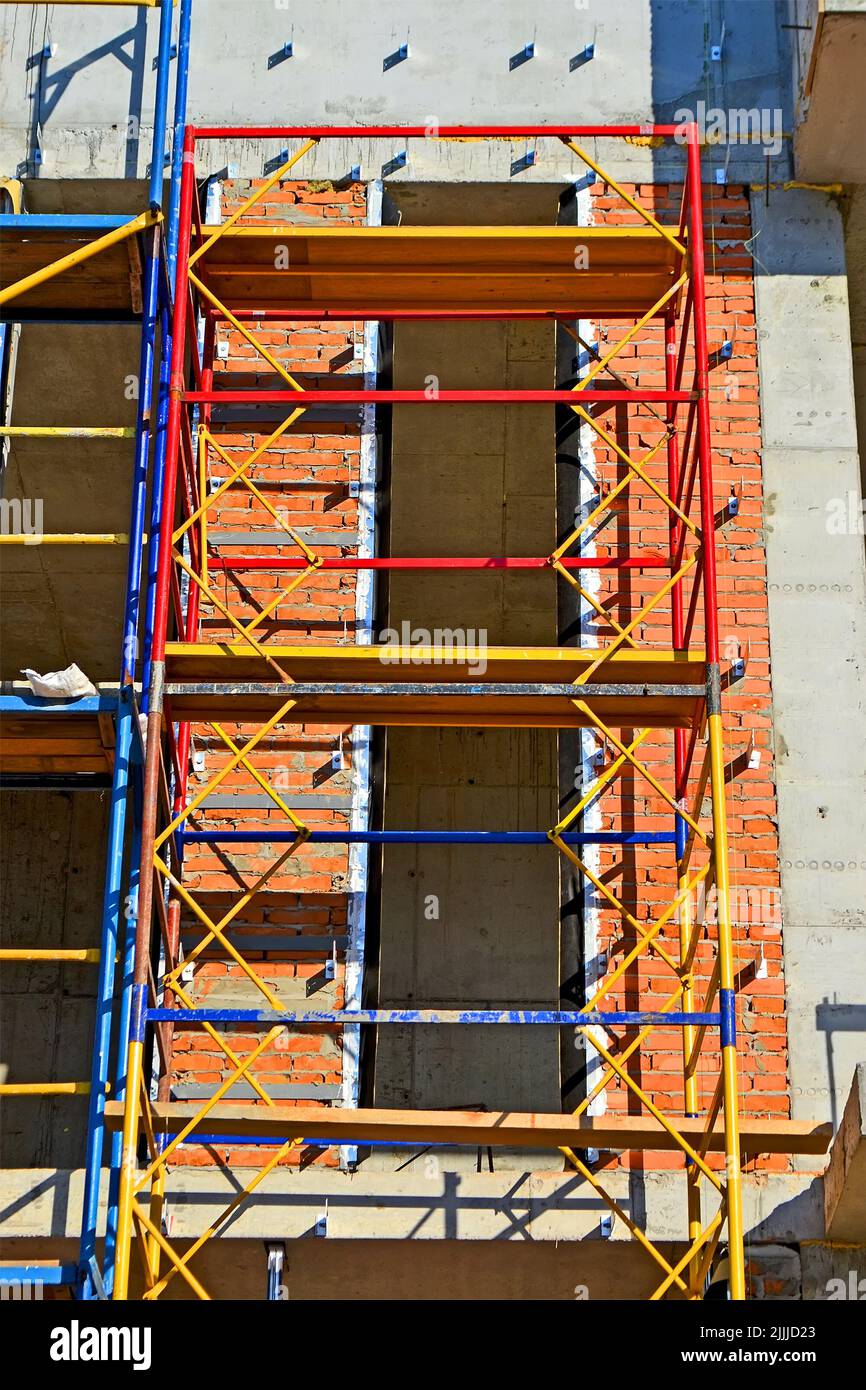colorful scaffolding in sunny day, modern building site diversity Stock ...