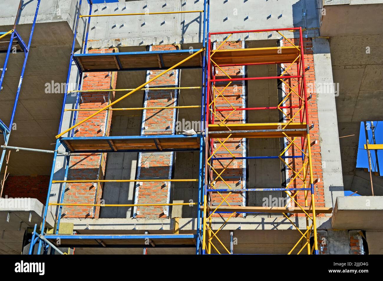 colorful scaffolding in sunny day, modern building site diversity Stock ...