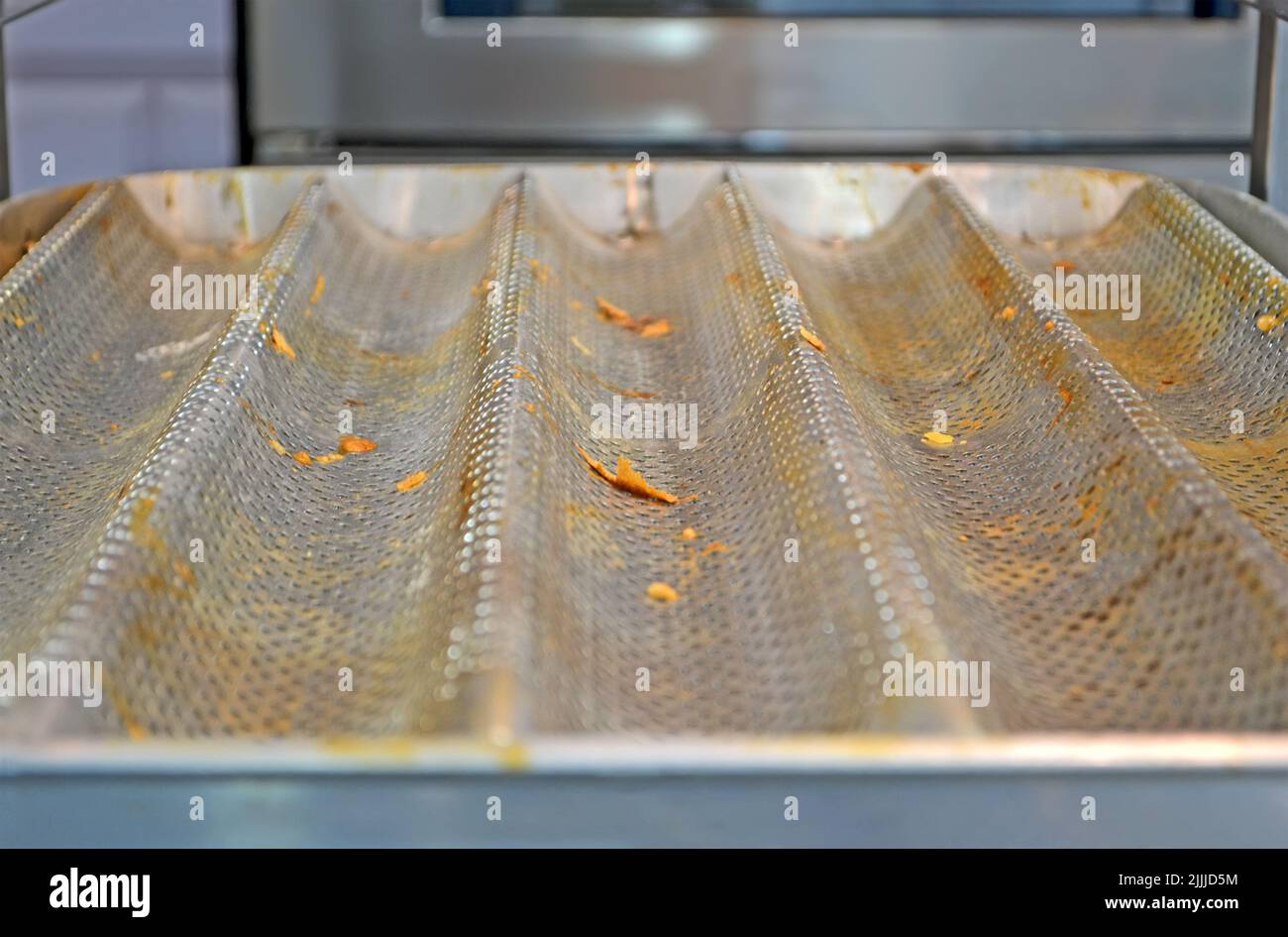 silver industrial metal separator with many holes, modern industry ...