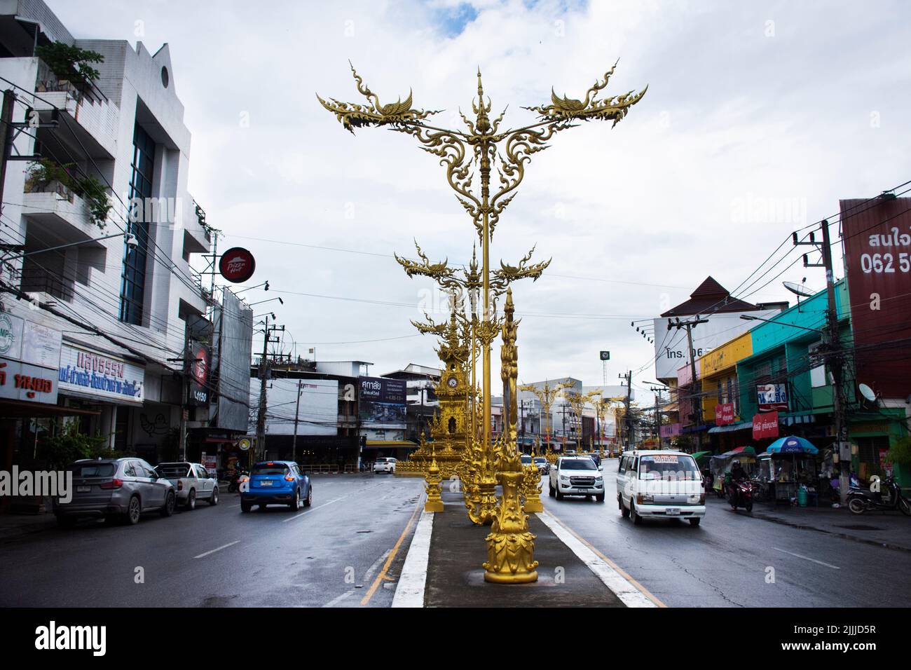 Traffic road on roundabout or tra c circle beautiful golden clock tower ...