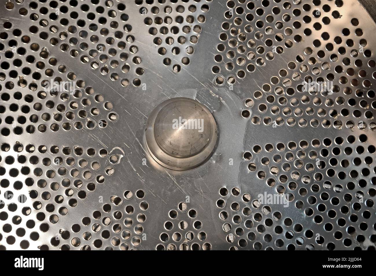 silver industrial metal separator closeup with many hole, modern ...