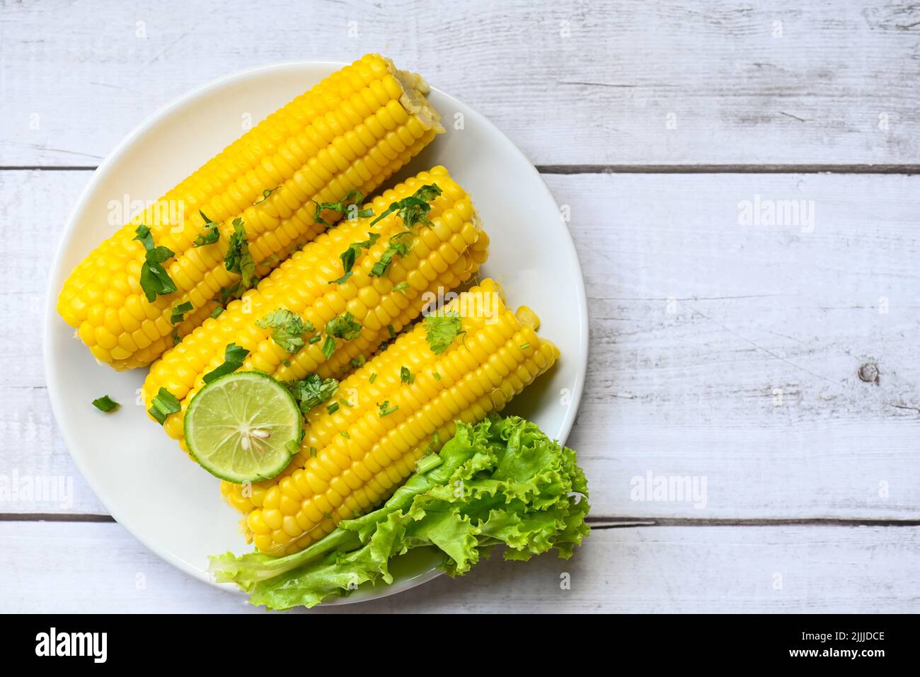 sweet corn food with salad vegetable lime coriander and lettuce, ripe ...