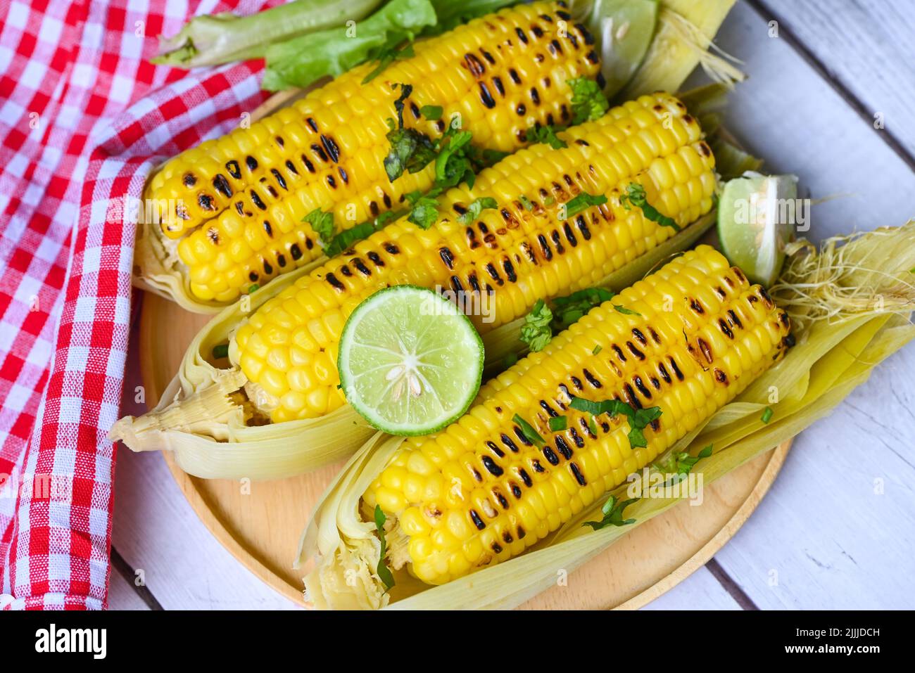 sweet corn cooked on wooden background, ripe corn cobs grilled ...