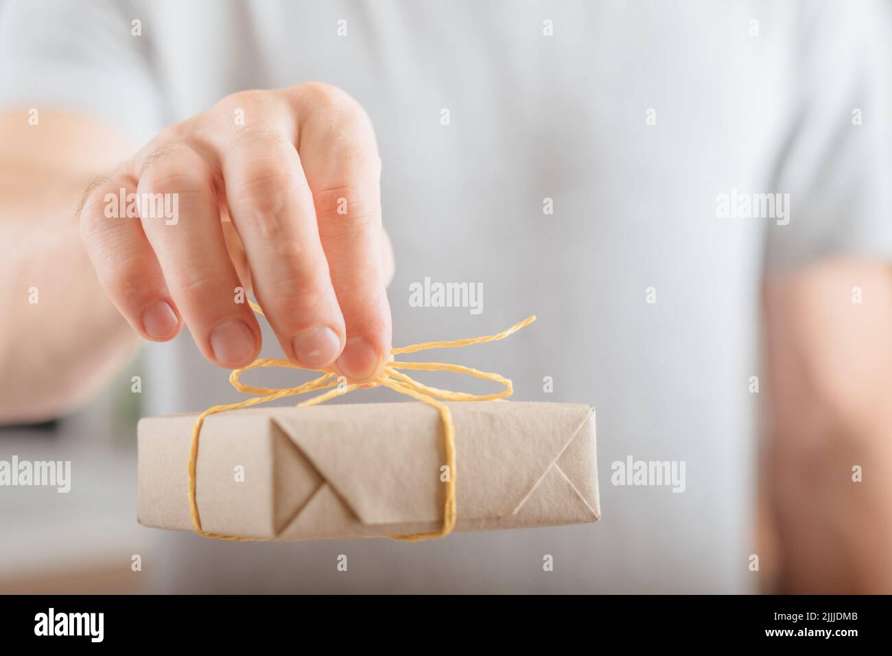 shop order delivery man box wrapped craft paper Stock Photo - Alamy