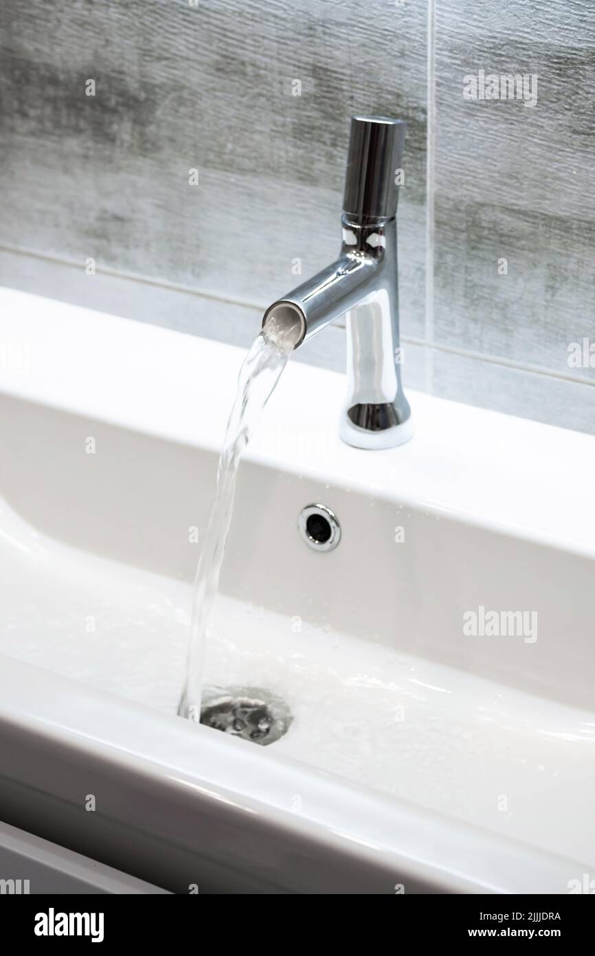 Water pouring from faucet sink hi-res stock photography and images - Alamy