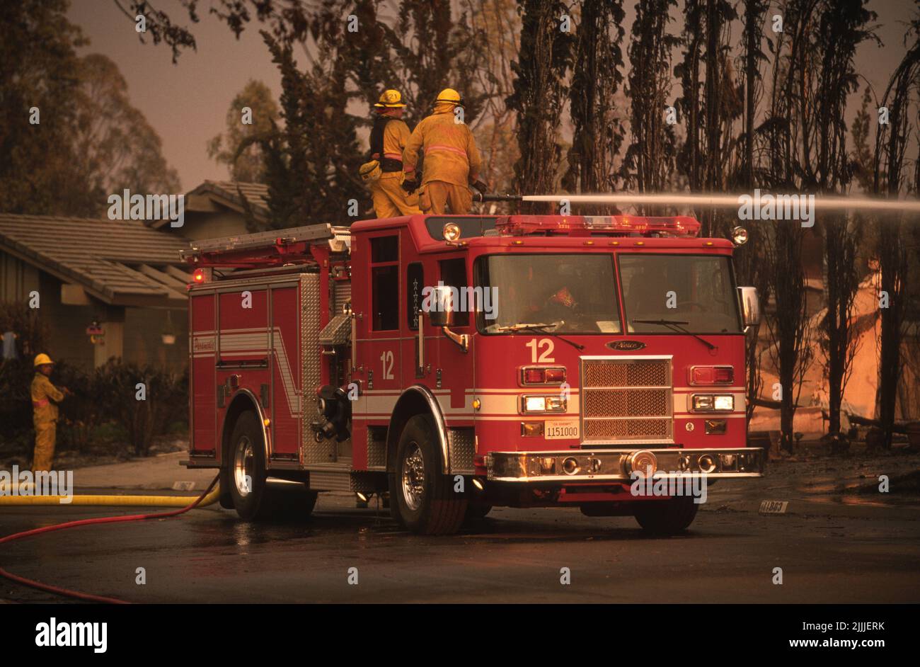 San Diego Fire-Rescue Engine 12's crew douses hot spots at the Cedar ...
