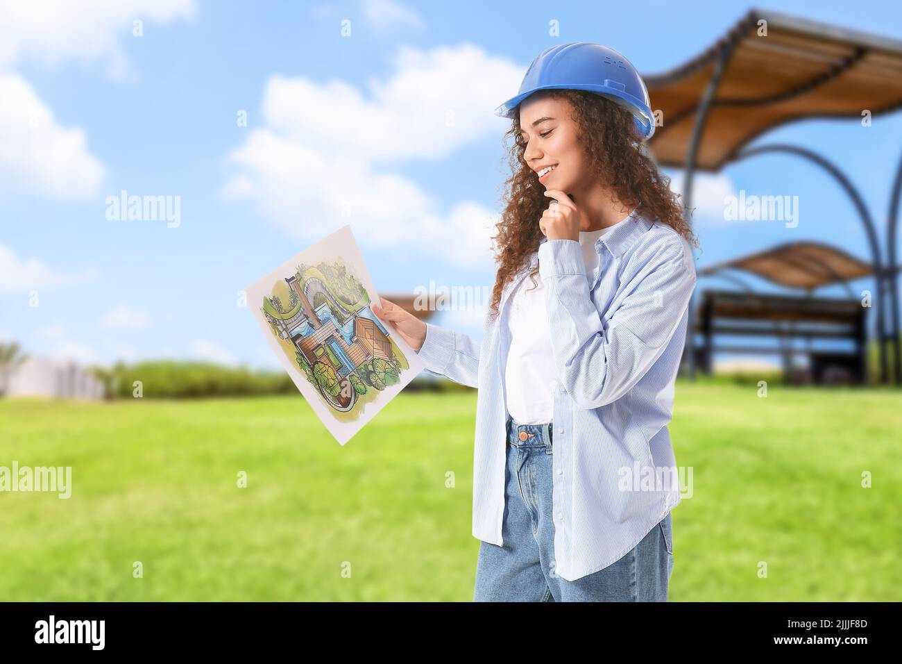 Female African-American landscape designer with new project outdoors ...