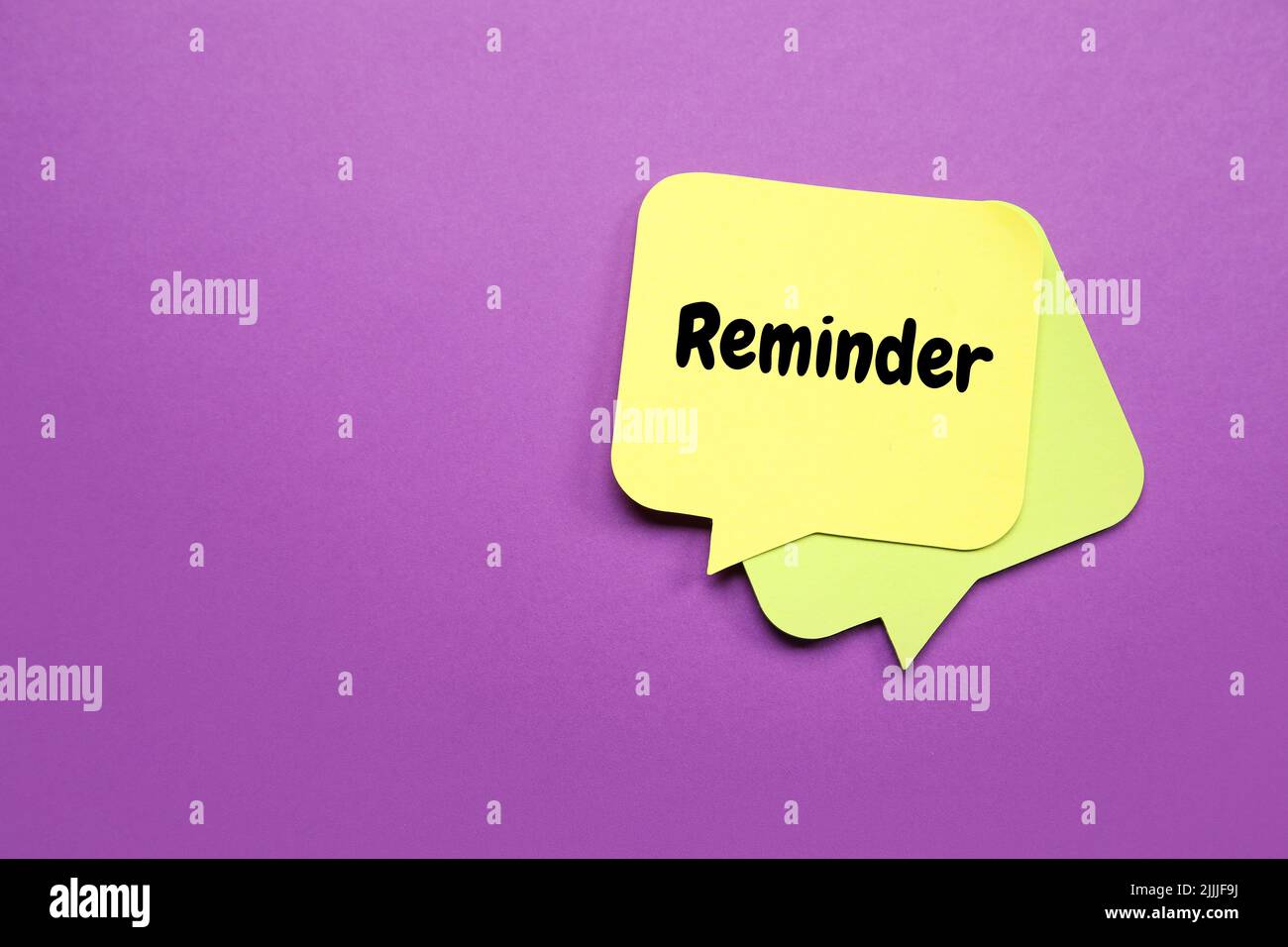 Sticky note with text REMINDER on violet background Stock Photo - Alamy