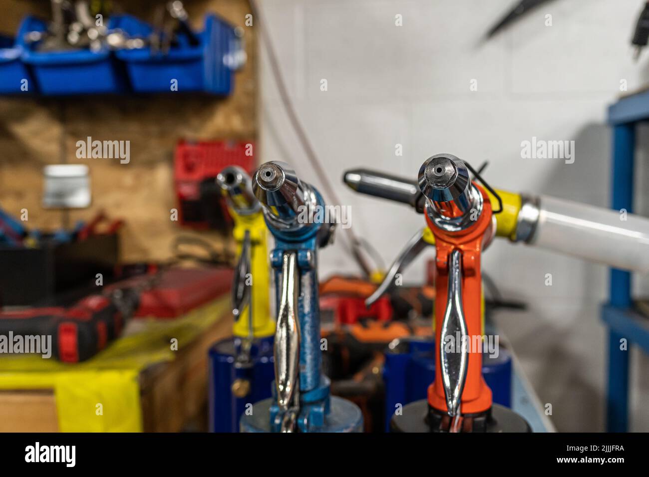 pneumatic Rivet Guns in a metal factory to fabricate Stock Photo - Alamy