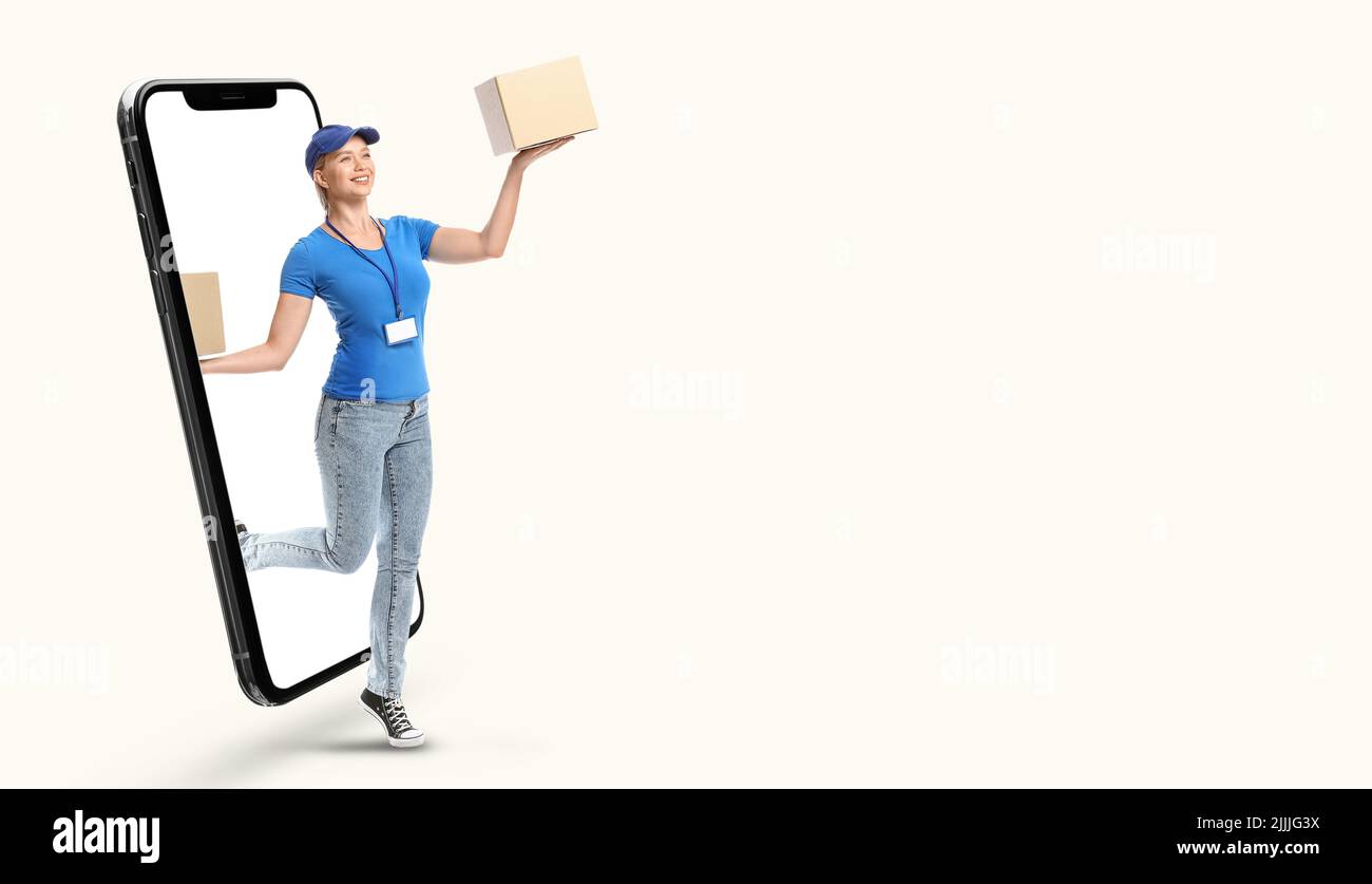 Female courier with parcels jumping out of smartphone screen on light ...