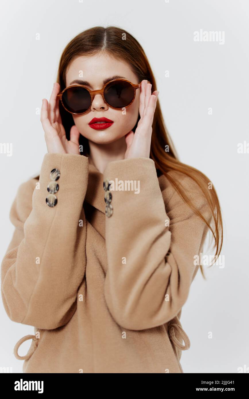 A red-haired professional model poses for a clothing brand magazine in ...