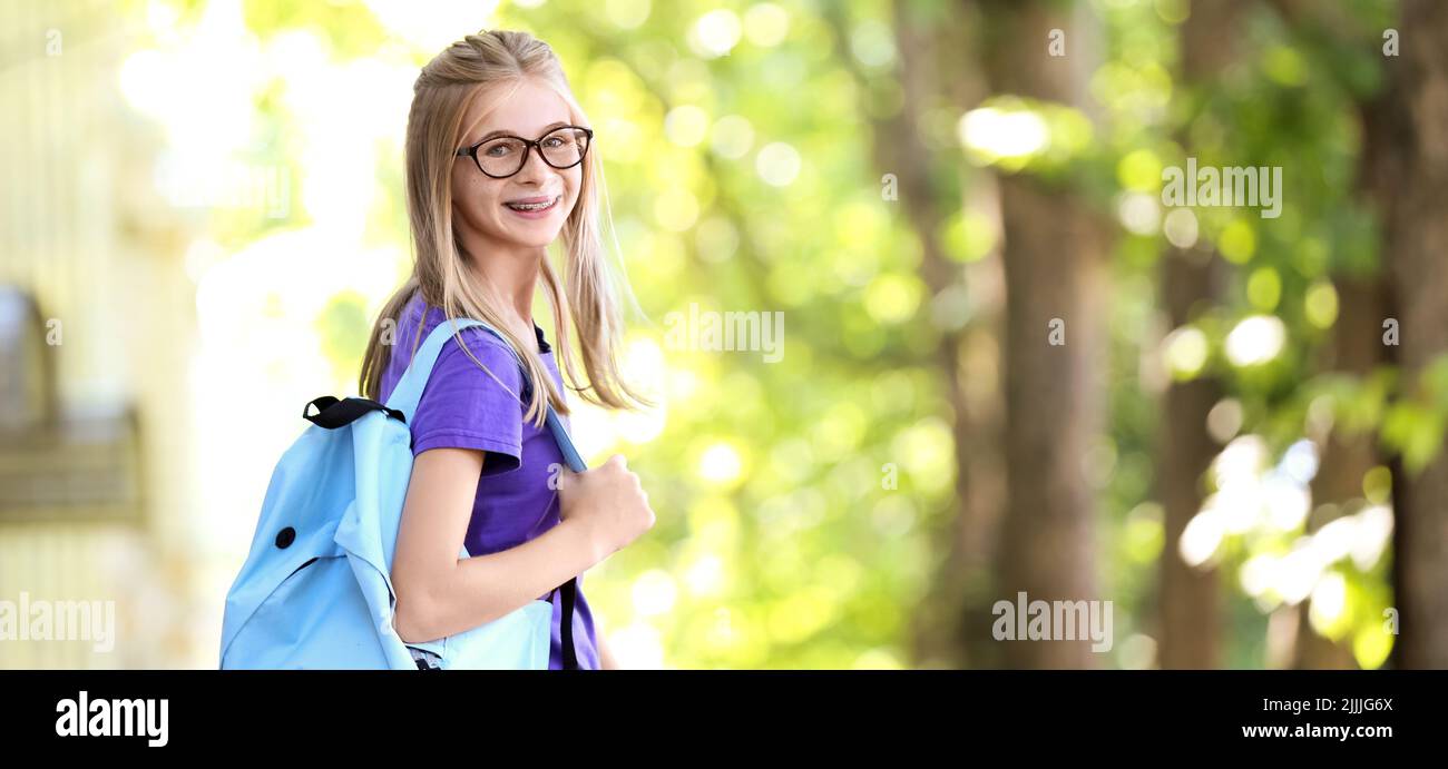 Teenage girl with backpack outdoors Stock Photo - Alamy