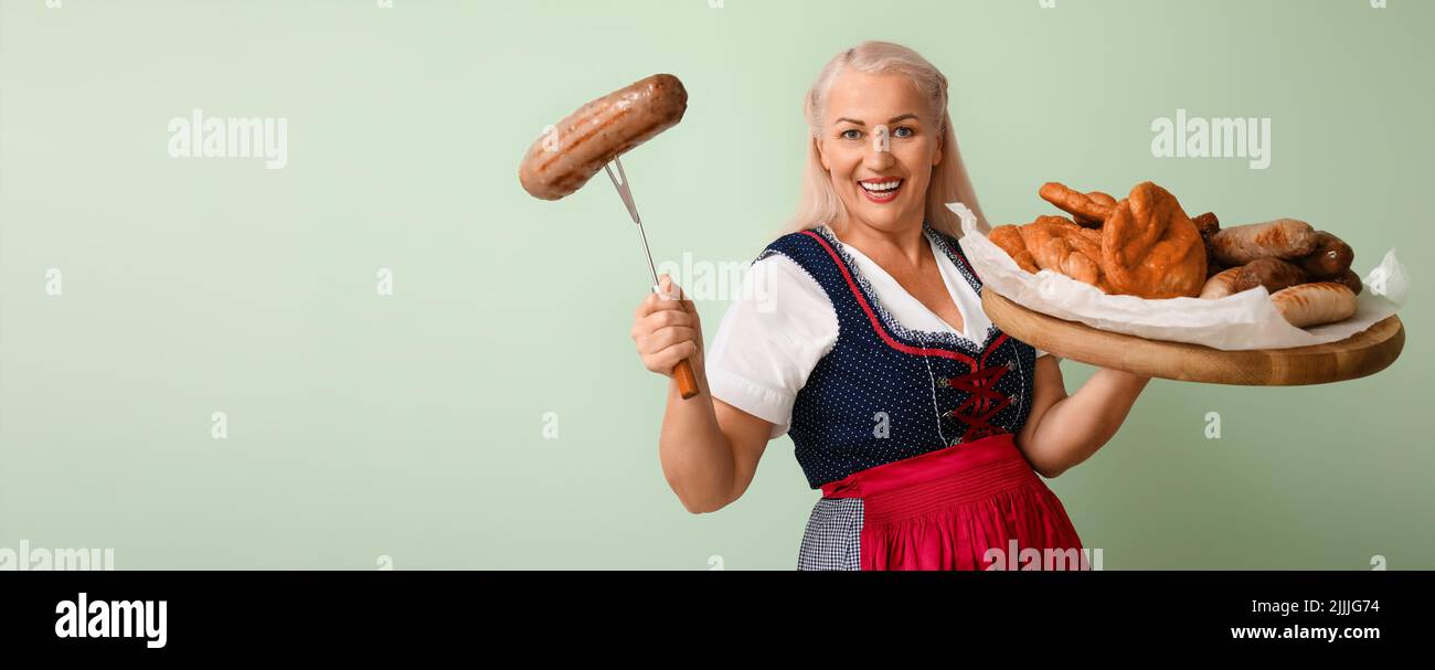 Oktoberfest waitress with snacks on green background with space for ...
