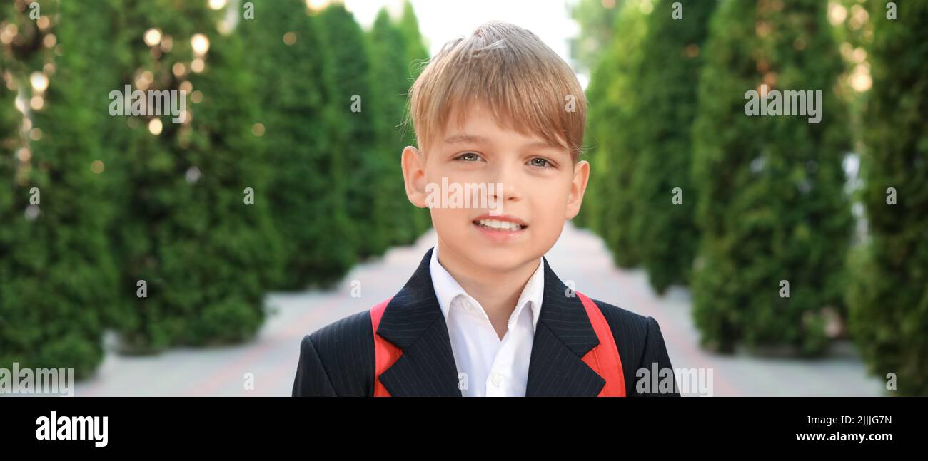 Cute little student after classes outdoors Stock Photo - Alamy