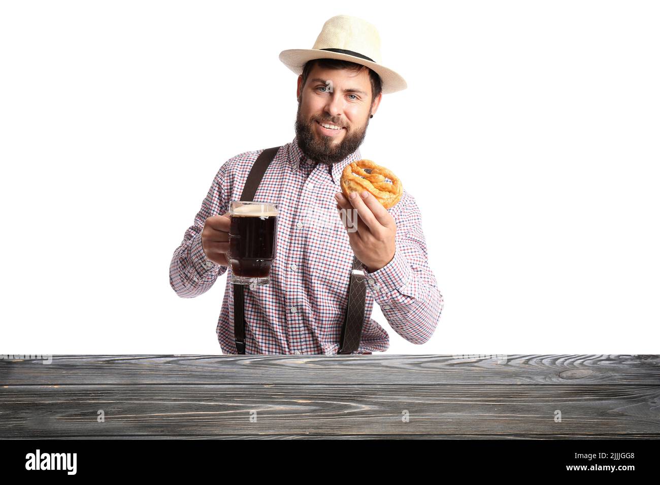 Handsome man in traditional German clothes, with beer and pretzel at ...