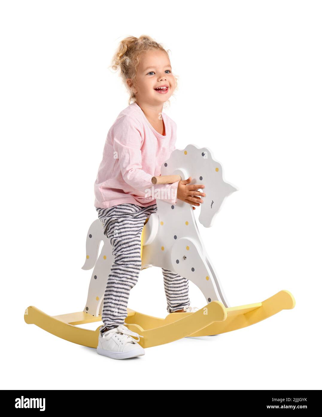 Adorable little girl with rocking horse on white background Stock Photo ...
