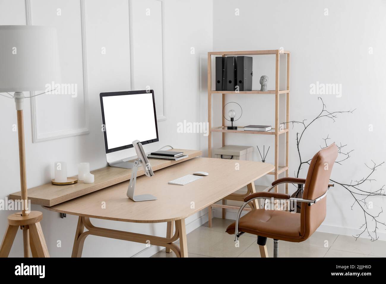 Modern workplace with computer and tablet in light office Stock Photo ...