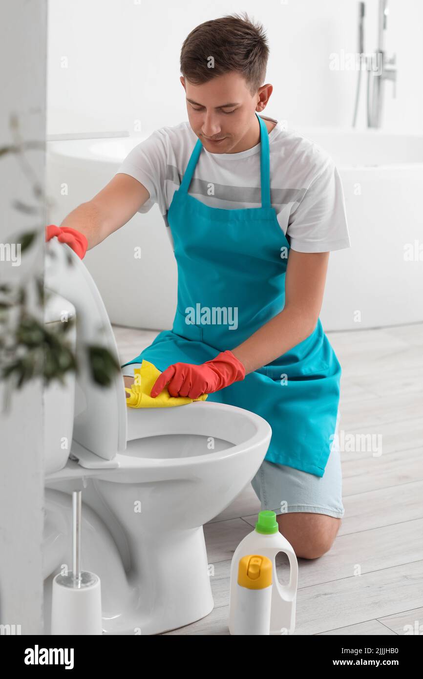 Man Cleaning Bathroom