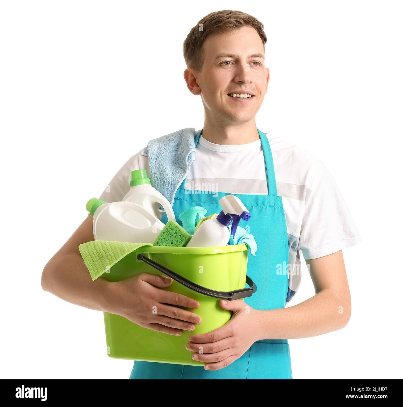 Young man holding bucket with cleaning supplies on white background ...