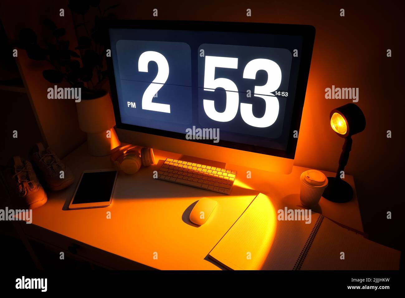 Workplace with modern computer in dark room Stock Photo - Alamy