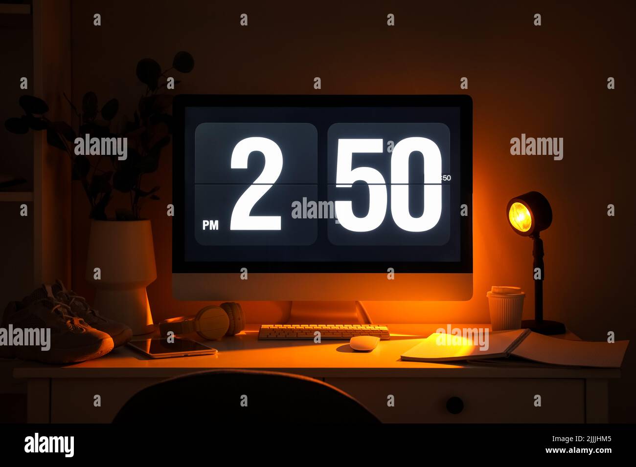 Workplace with modern computer in dark room Stock Photo - Alamy