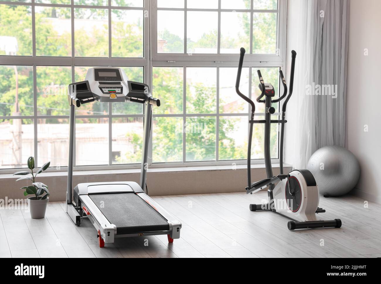 Interior of modern gym with treadmill and sport equipment Stock Photo ...