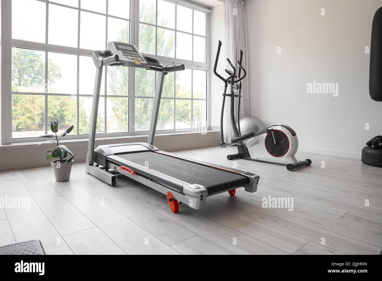 Interior of modern gym with treadmill and sport equipment Stock Photo ...