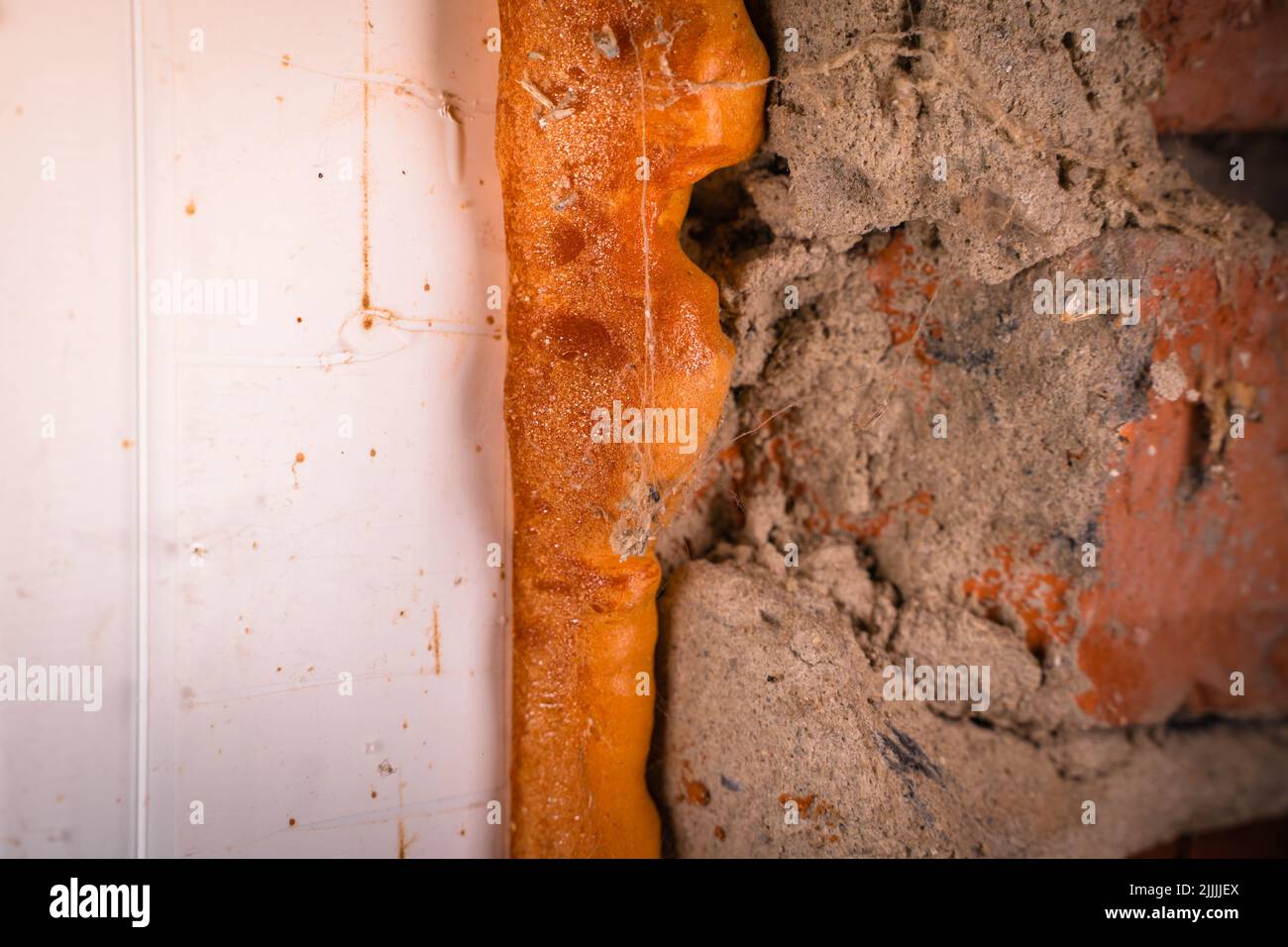 Old polyurethane foam close-up. Corrosion and destruction of building ...