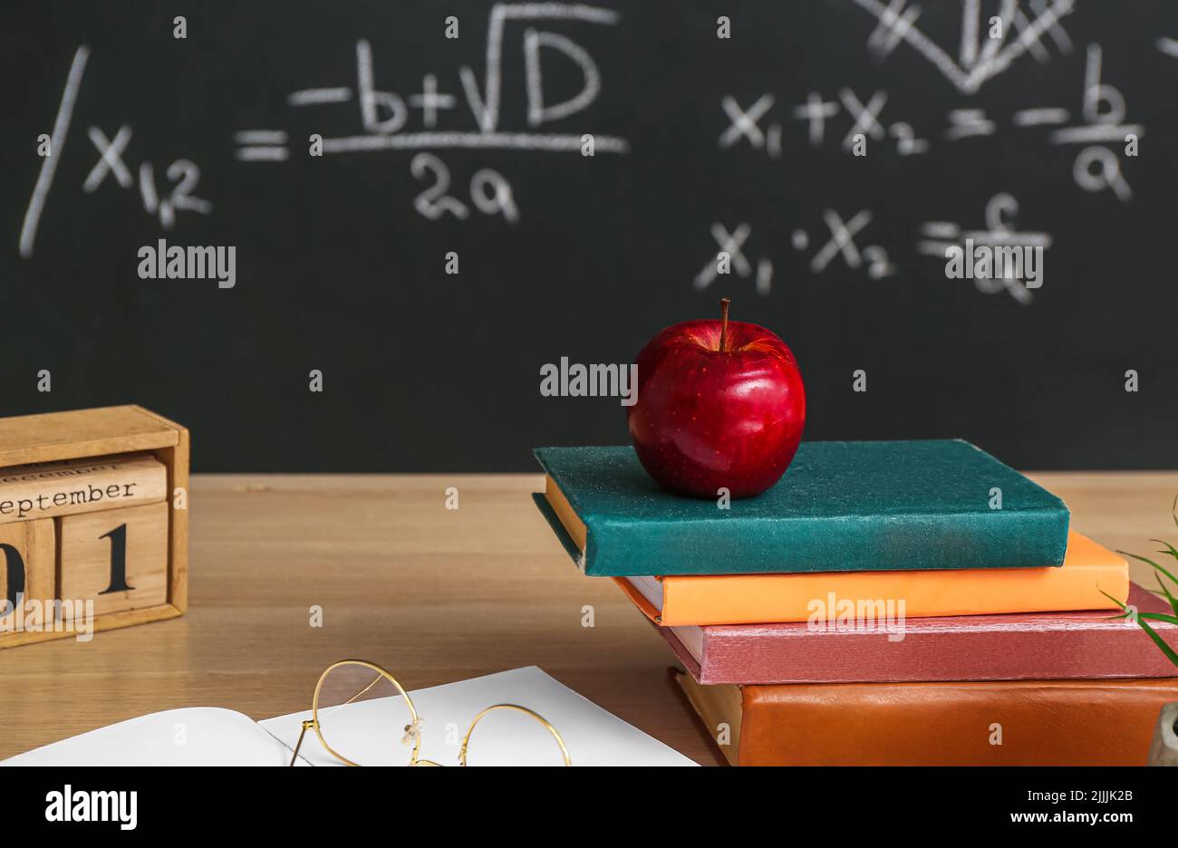 Cube calendar with date 1 SEPTEMBER, apple, books and eyeglasses on ...