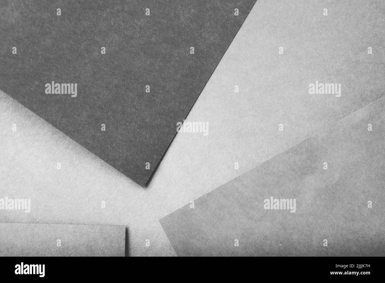 paper layer abstract grey sheet collage background Stock Photo - Alamy