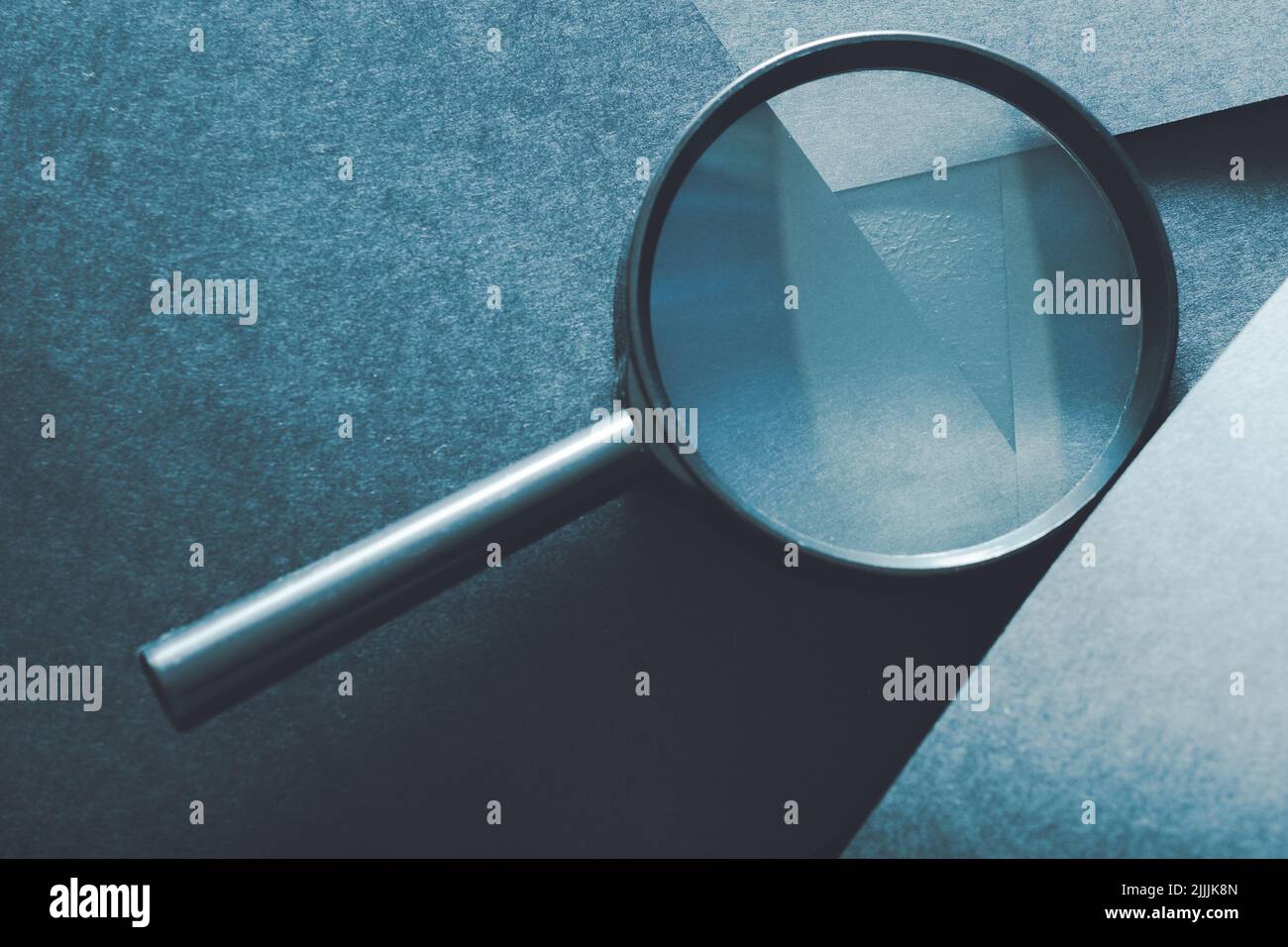 magnifying glass comparison assessment analysis Stock Photo - Alamy