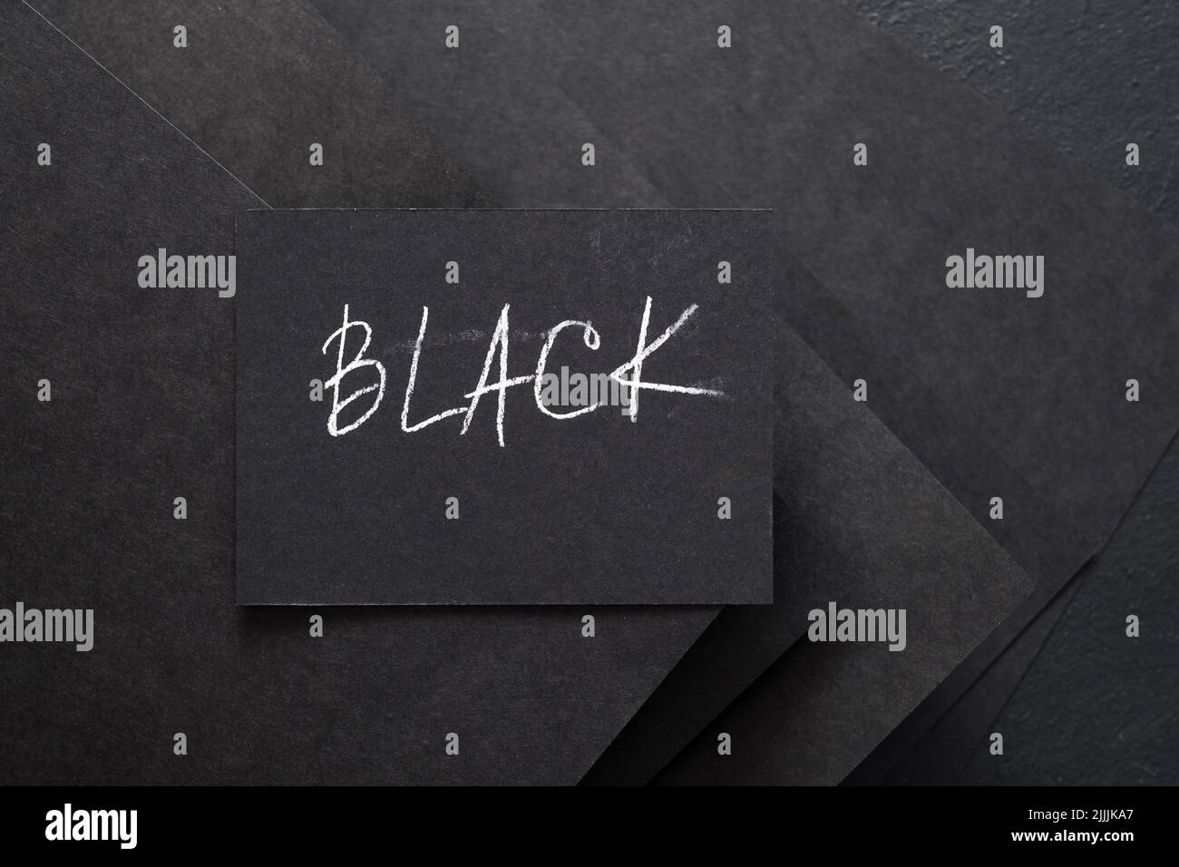 word black written layer paper background contrast Stock Photo - Alamy