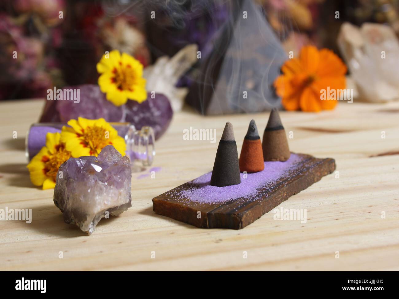 Incense Cones on Stone Slab With Rock Crystals and Flowers Stock Photo ...