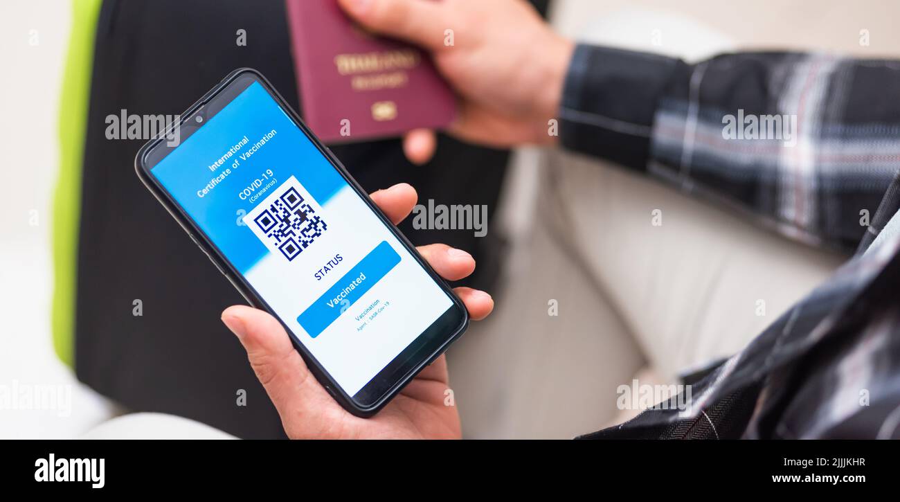 Vaccination passport, Traveler man holding health passport of ...