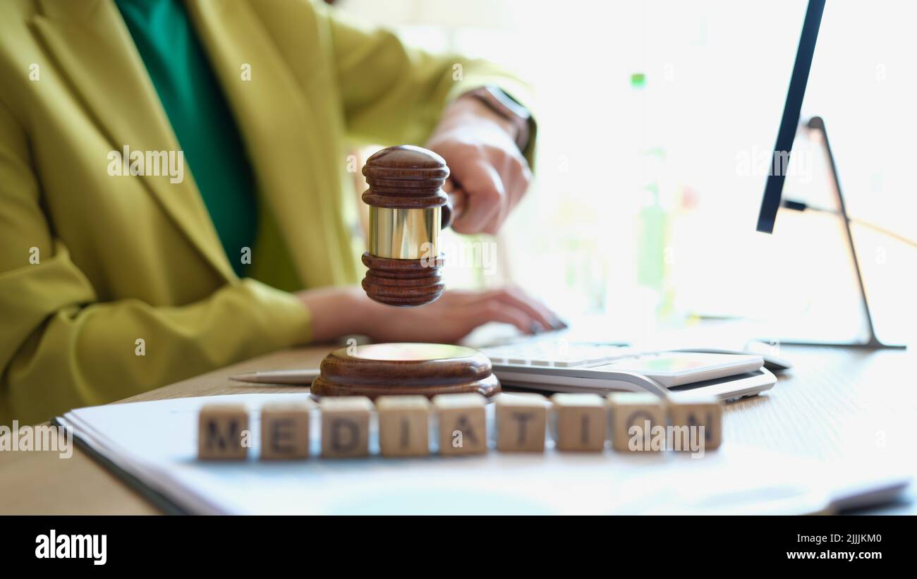 Female hand striking gavel in court room Stock Photo - Alamy
