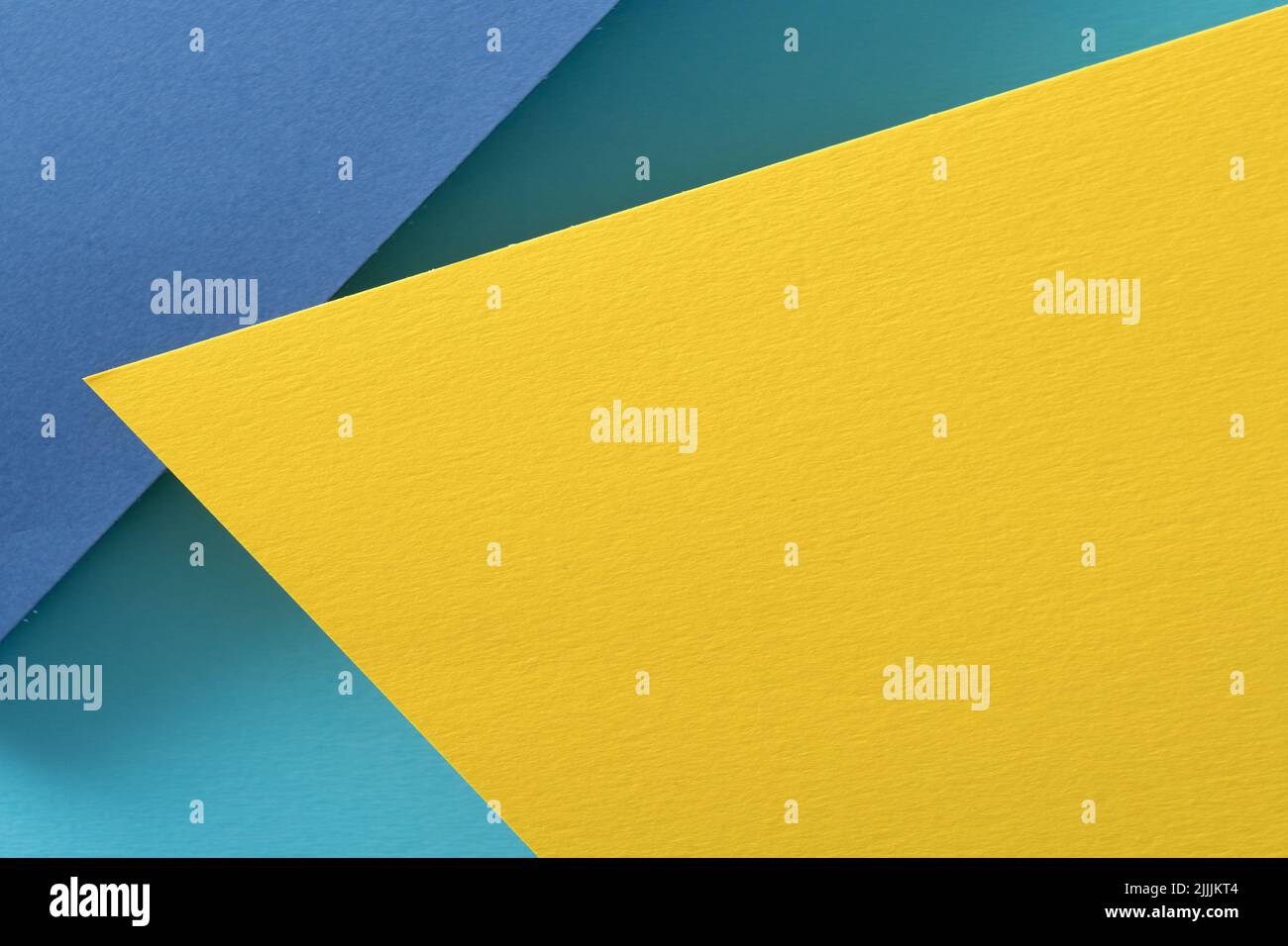 layered construction paper background yellow blue Stock Photo - Alamy