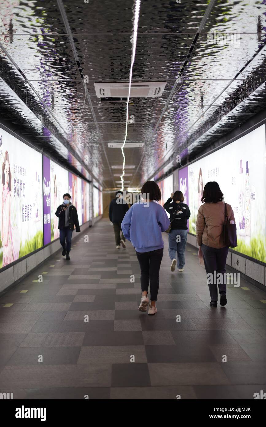 People walking in an underground tunnel in Shanghai Stock Photo - Alamy