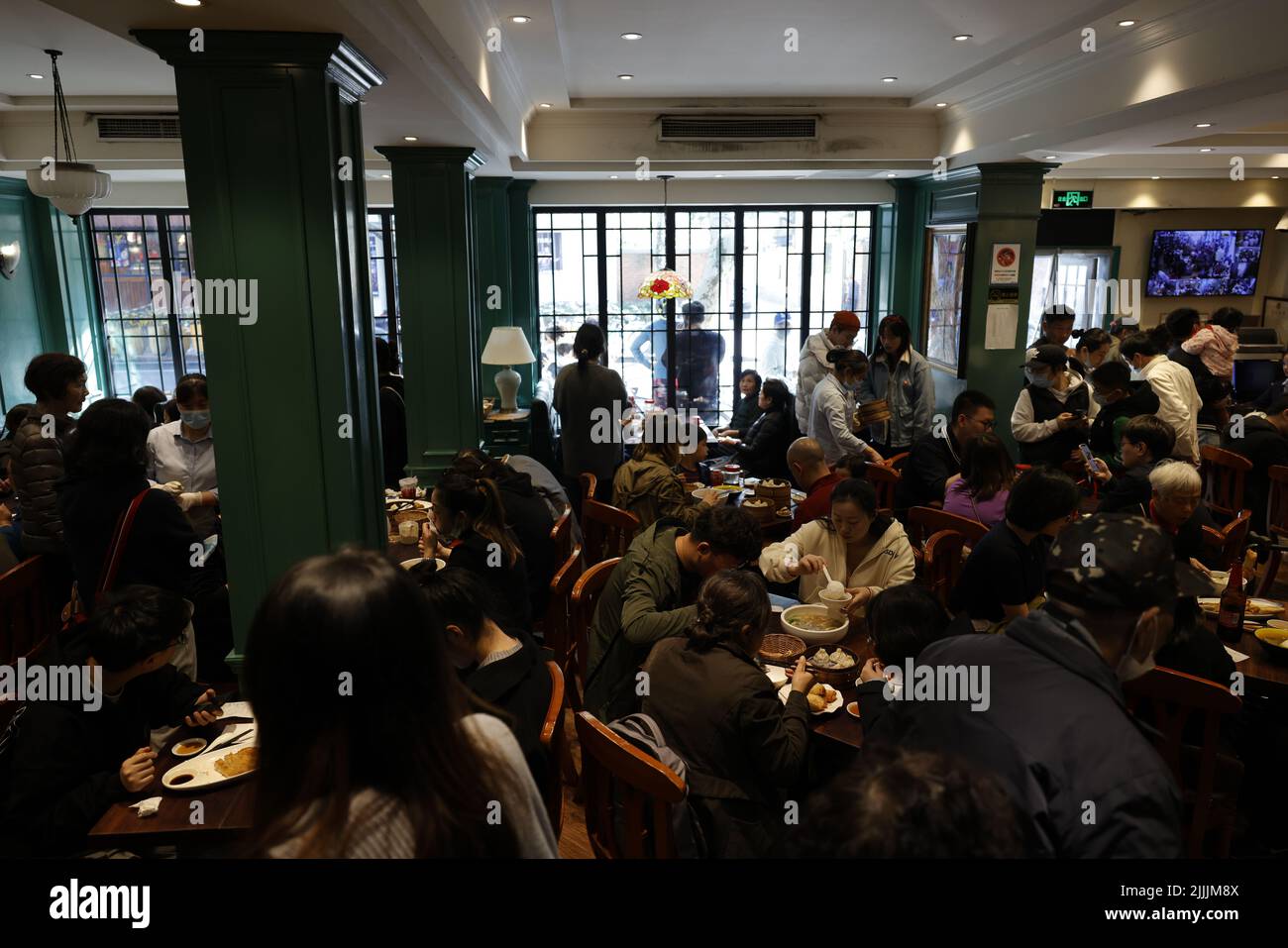 A busy restaurant with people enjoying their time Stock Photo - Alamy
