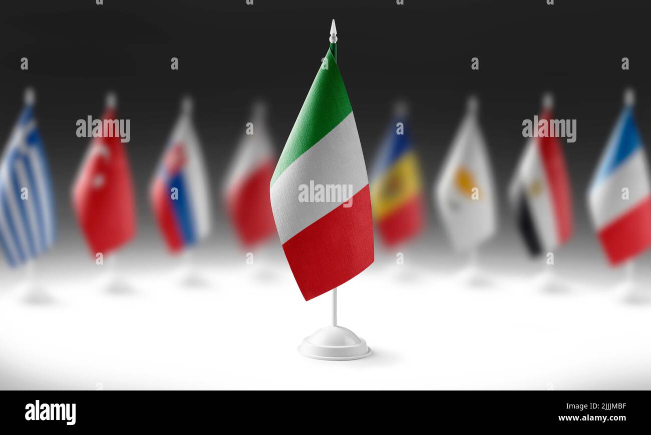 The national flag of the Italy on the background of flags of other ...
