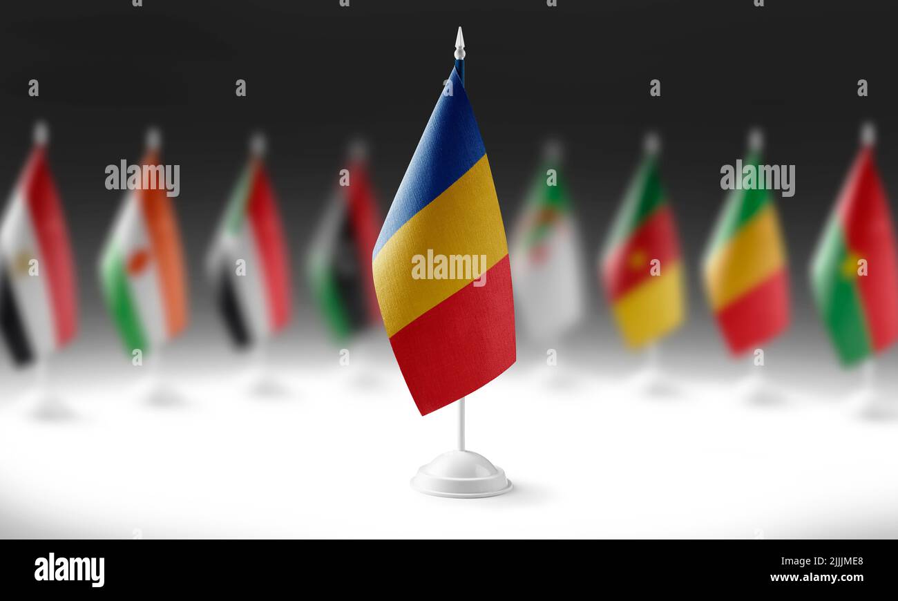 The national flag of the Chad on the background of flags of other ...