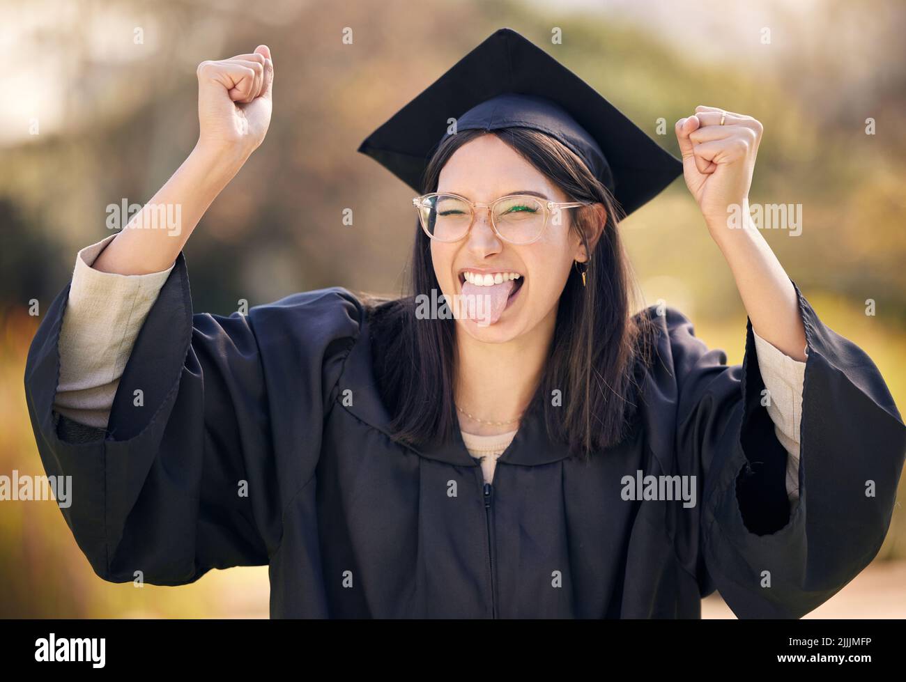 Guess who got her degree...me. a young woman cheering on graduation day ...