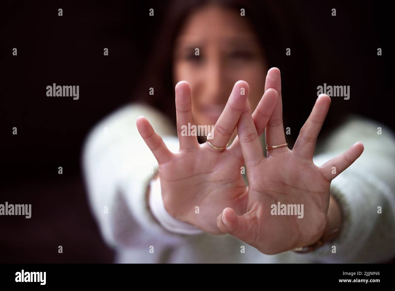 Please dont hurt me. a young woman looking distressed and reading out ...