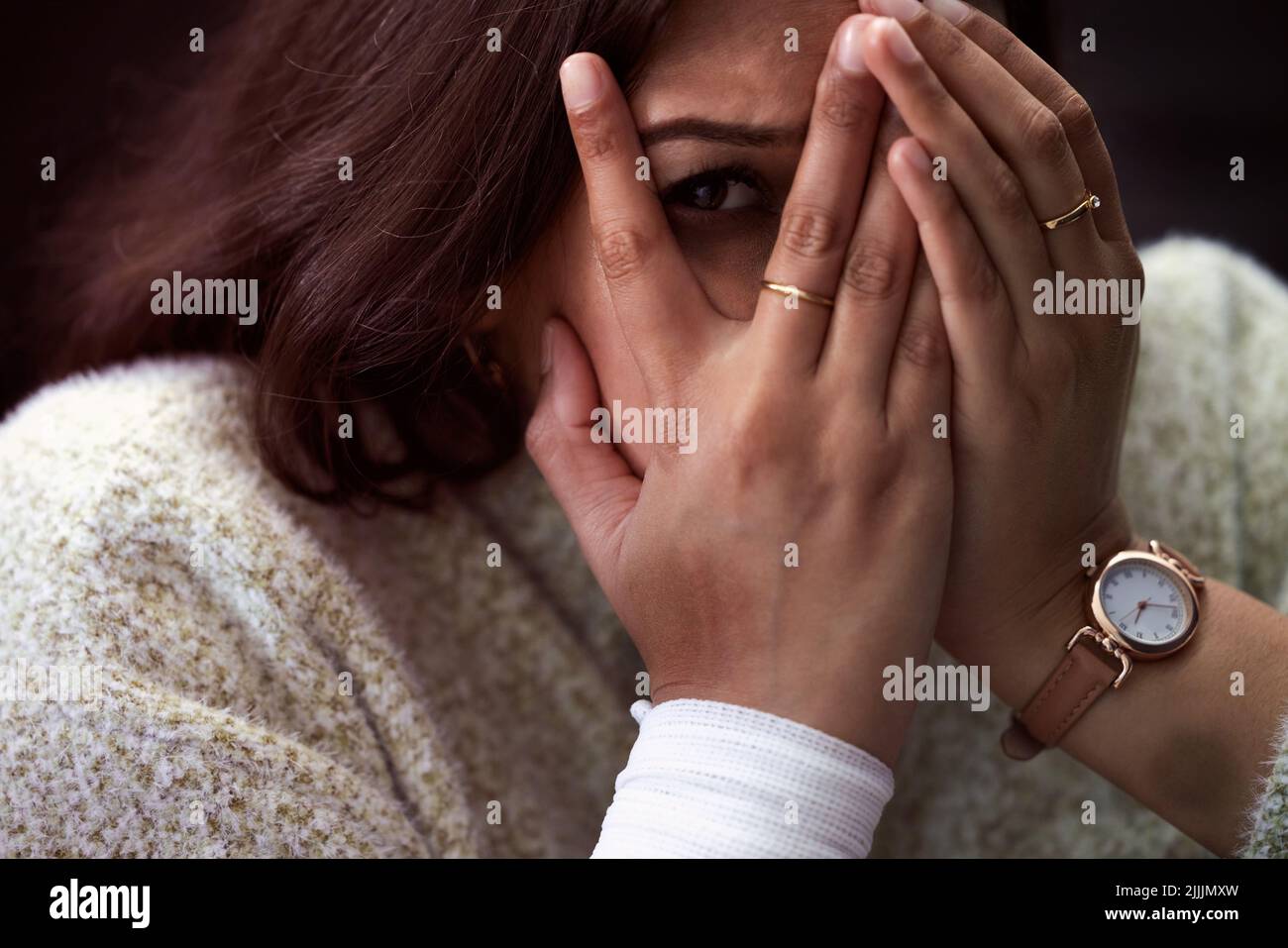 Get away before it gets you. a young woman sitting on the floor and ...