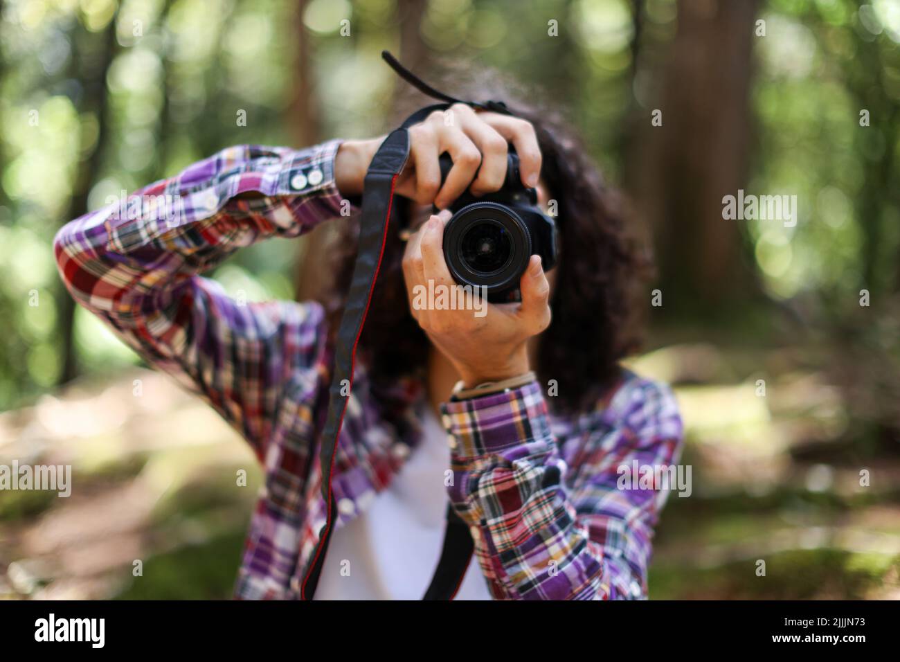 Faceless photographer taking picture of you in the forest at Costa Rica ...