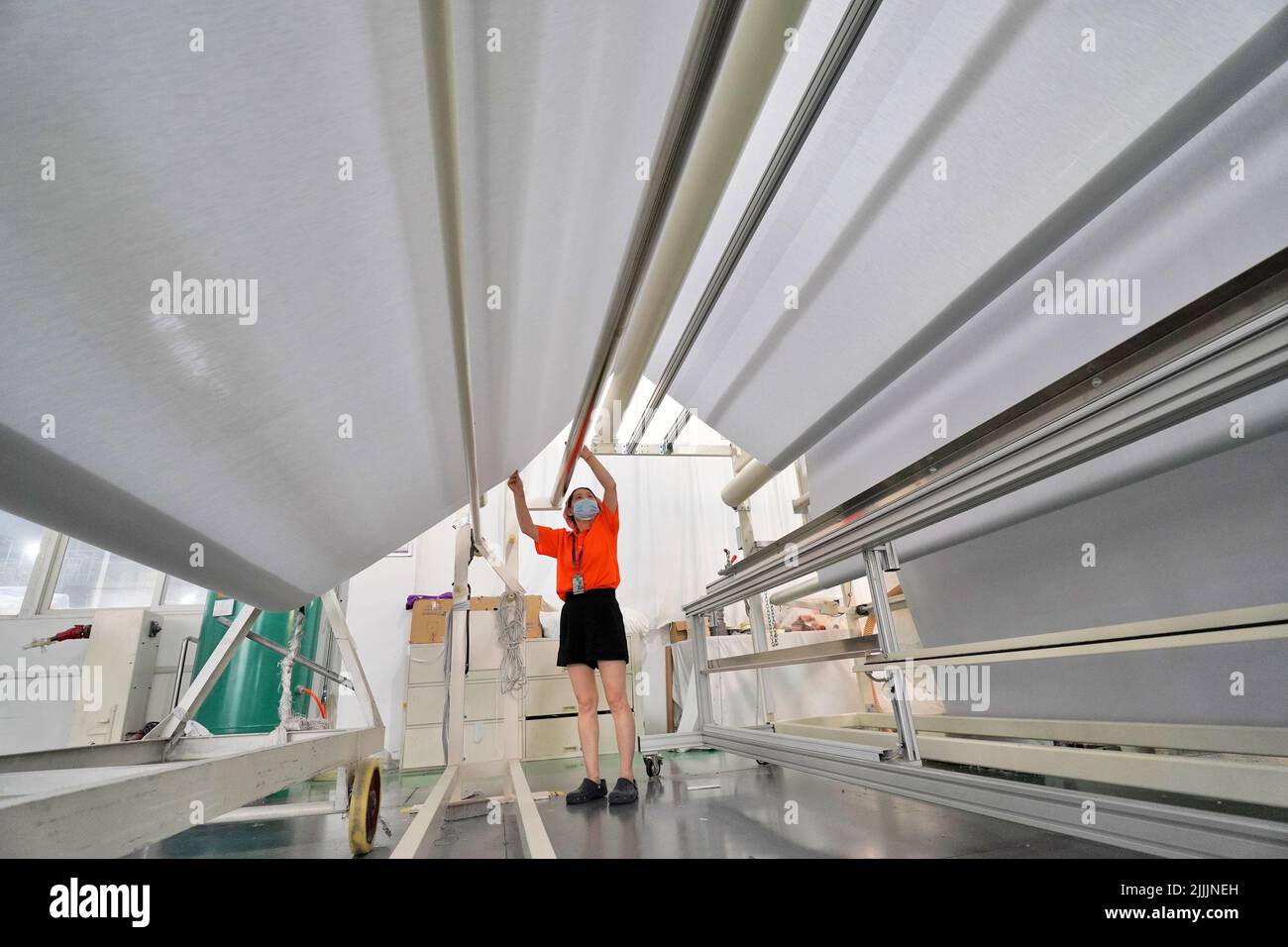 YANTAI, CHINA - JULY 27, 2022 - A worker works on a production line at ...